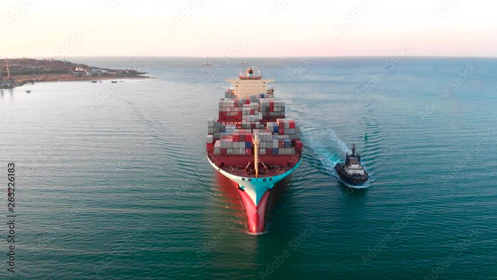 Large modern container ship moves along the route and arrives at the ...