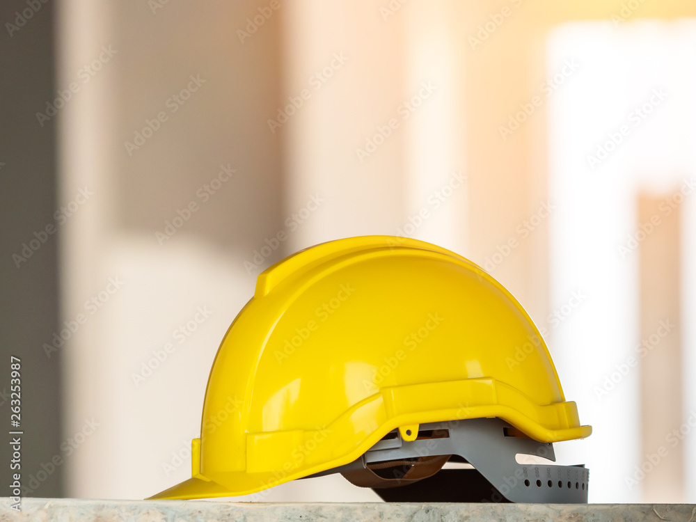 Construction safety concept, yellow hard safety helmet hat in ...