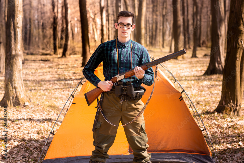 Autumn hunting season. Man hunter with a gun. Hunting in the woods ...