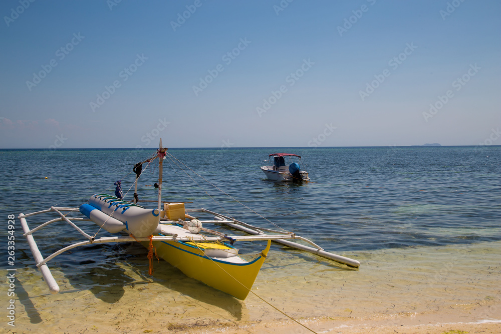 Banana boat placed on a Pump boat outrigger for water sports activities ...