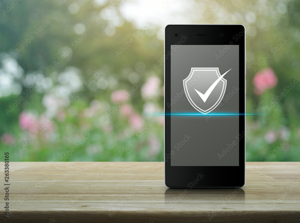 Security shield with check mark icon on modern smart mobile phone ...