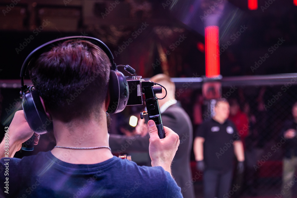 Video filming in the backstage of a sporting event. Athletes fighters ...