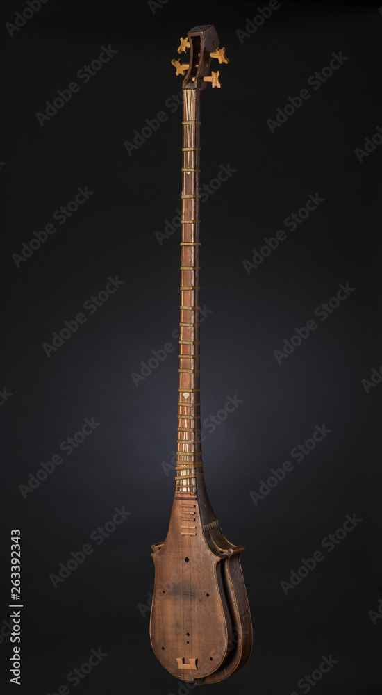 ancient Asian stringed musical instrument on black background with ...