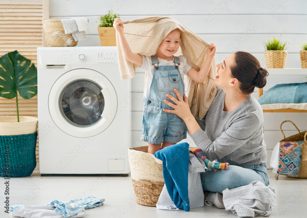 family doing laundry Stock Photo | Adobe Stock
