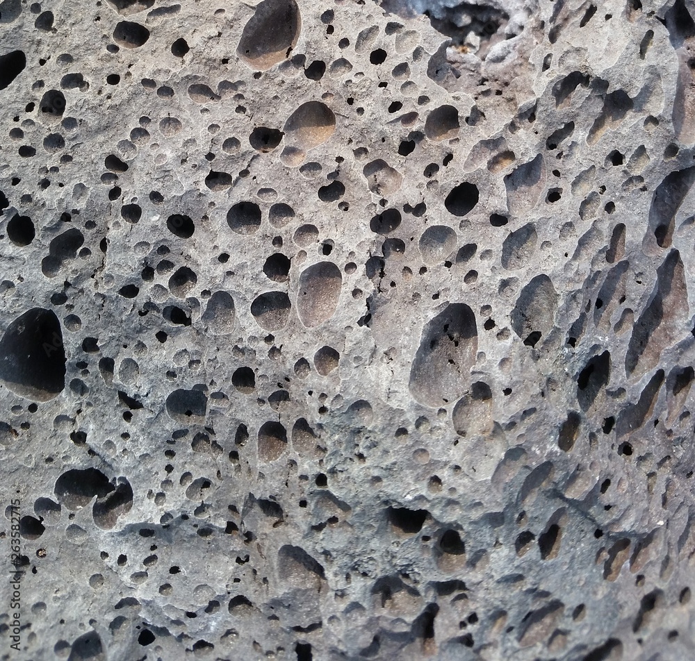 Macro image of lava rock showing the intricate rough texture of the ...
