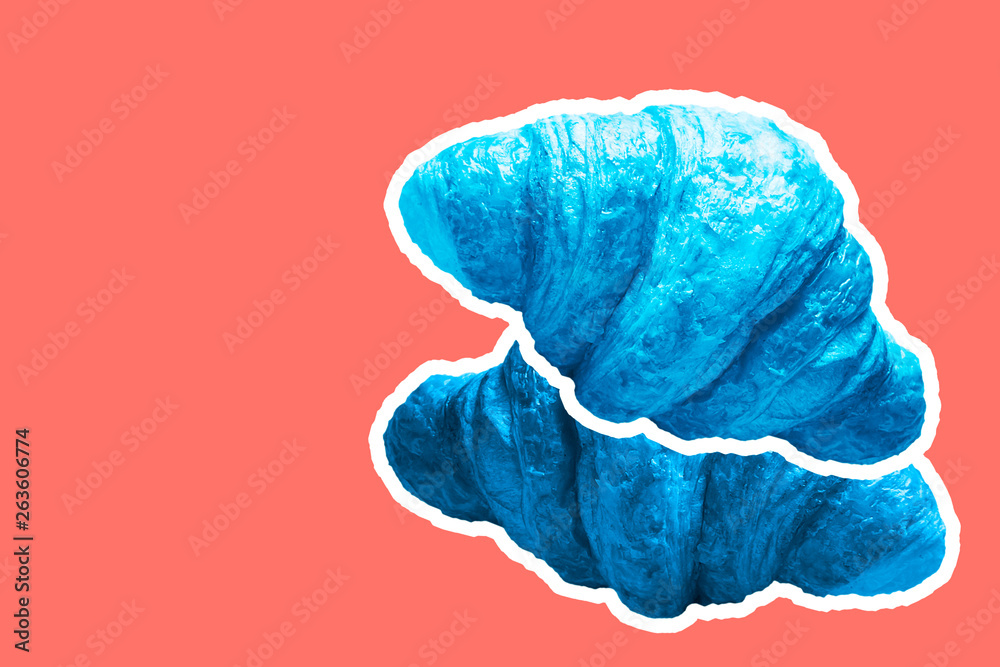 Surreal blue croissants on coral background. Minimal crazy food concept ...