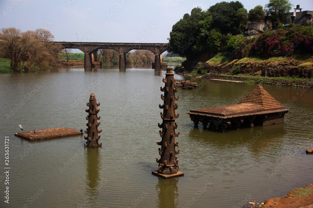Old temple and deepmala, stone structure for lights, inside Panchganga ...