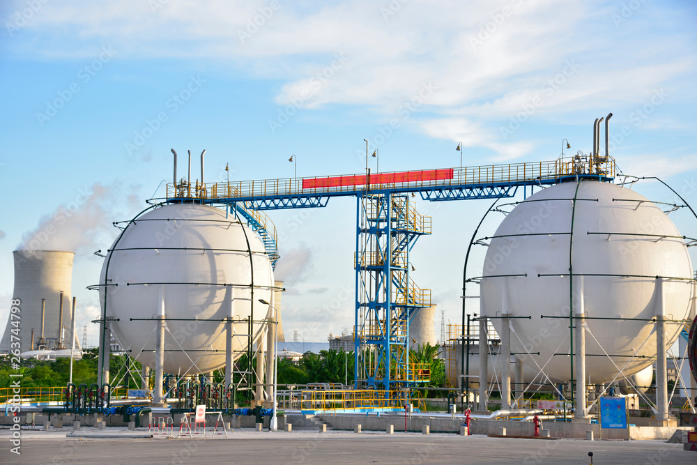Refinery storage tanks and containers of ethanol under the blue sky ...