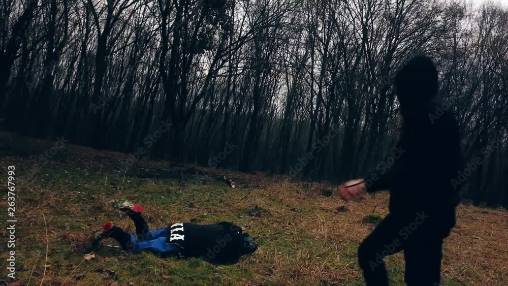 Actor holds long sword blade between the palms of his hands then jumps ...