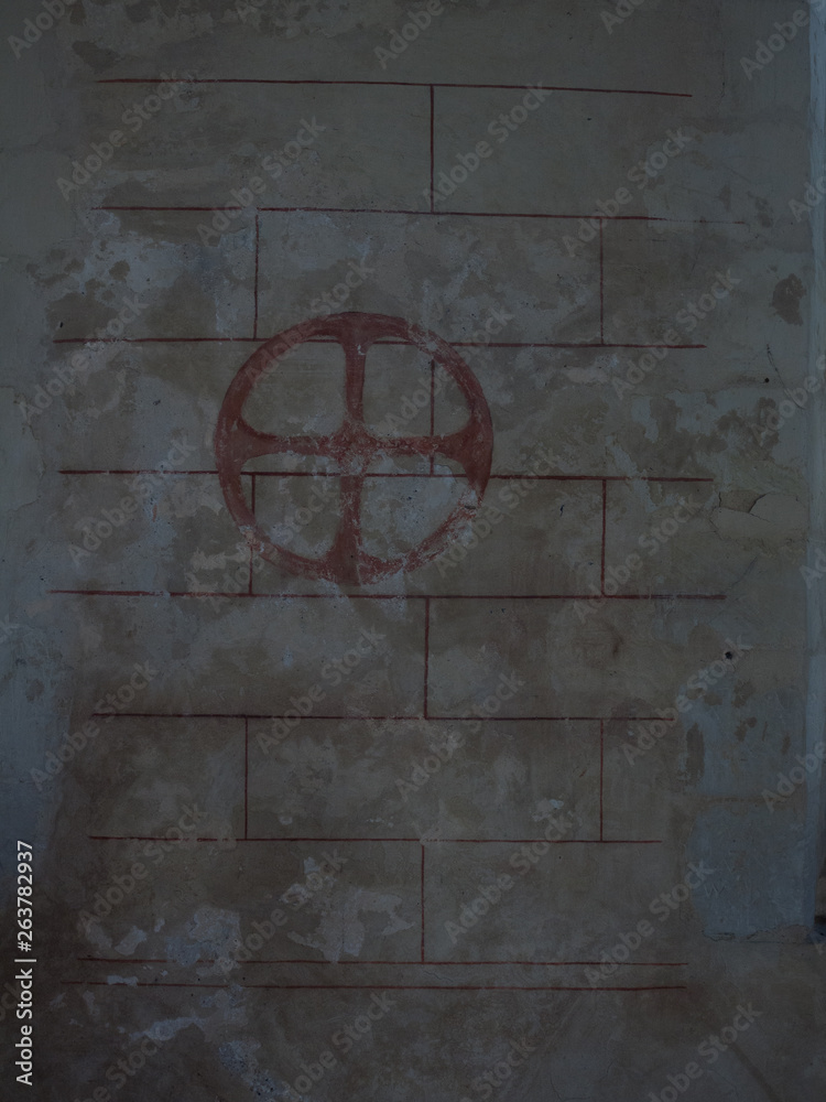 Old red circle and cross knights templar symbol wall church Stock Photo ...