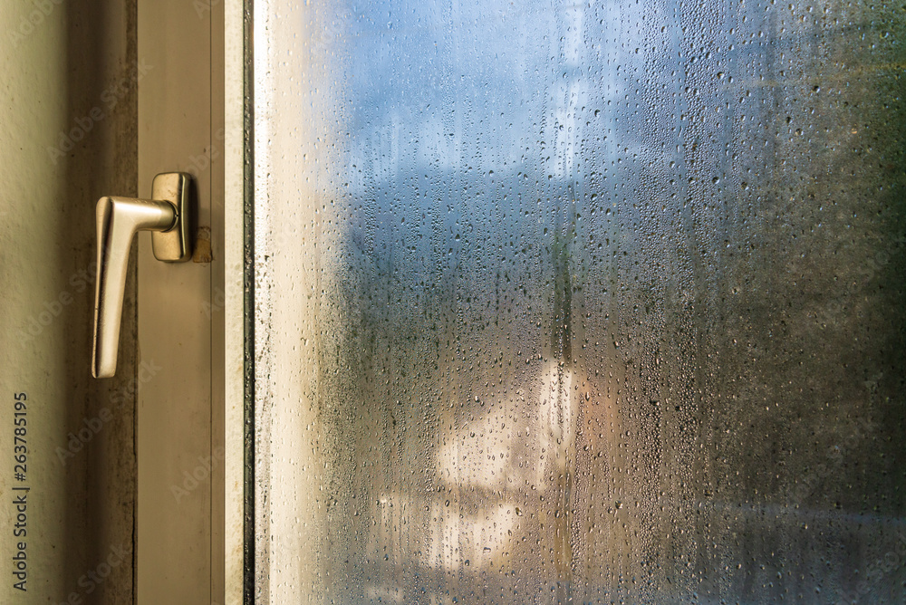 Interior view of droplet of water, dew or stream on transparent glass ...