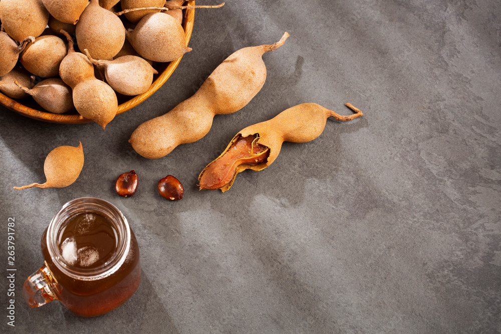 Tropical fruit of tamarind - Tamarindus indica. Text space Stock Photo ...