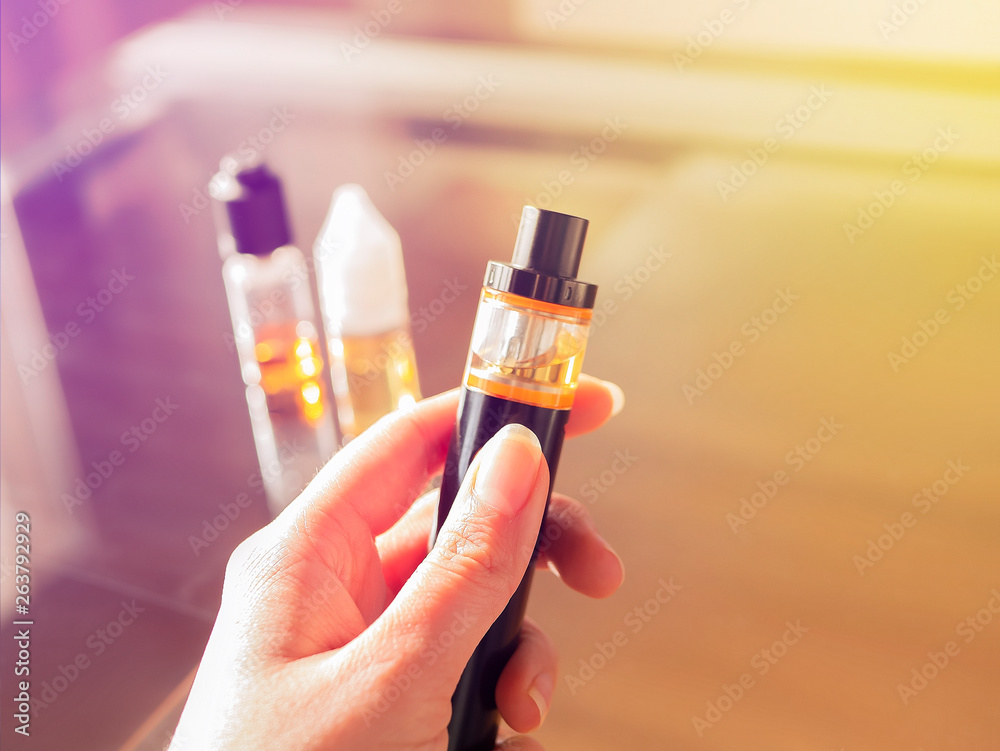 E-cigarette for vaping. Popular vape device with liquids. No smoking ...