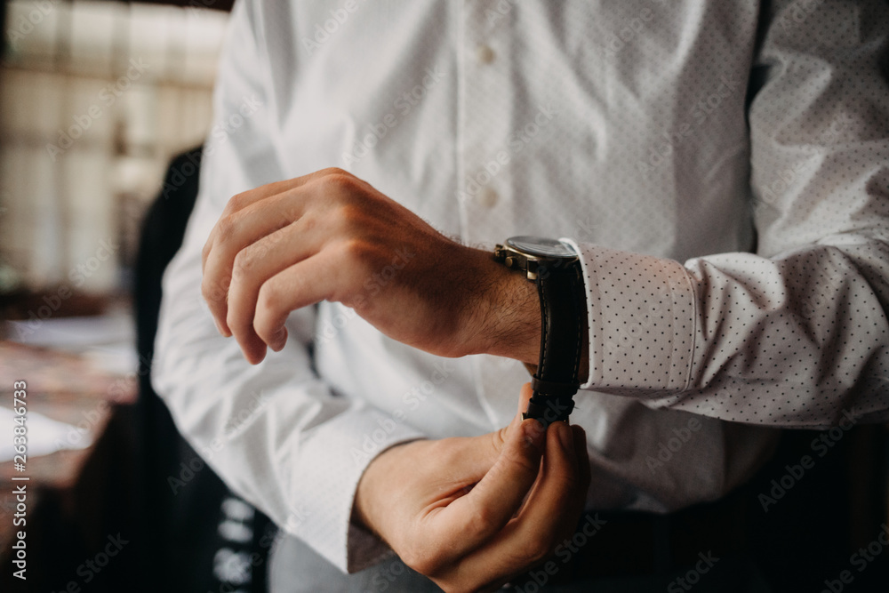 Man Putting on Watch Stock Photo | Adobe Stock