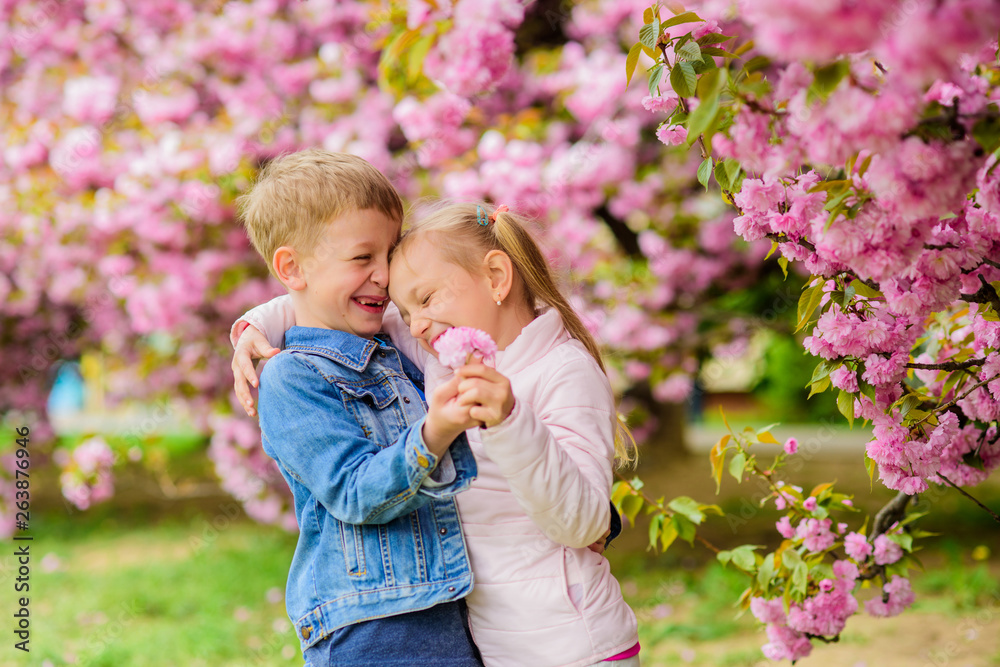 Foto de Tender love feelings. Little girl enjoy spring flowers. Giving ...