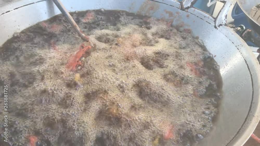Video Stock handheld close shot of deep fry pan on a local street food ...