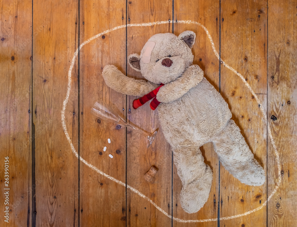 Teddy bear lying on floor with an empty glass, pills and chalk outline ...