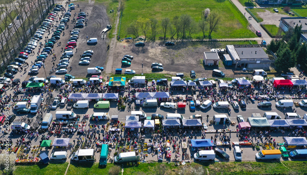 Aerial view on flea market with miscellaneous items and crowds of ...