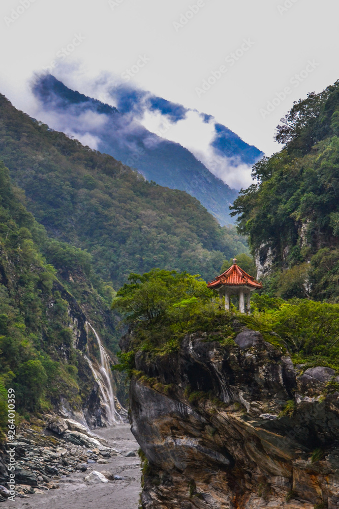 Scenic landscape panoramic view of Taroko Gorge and small temple with ...