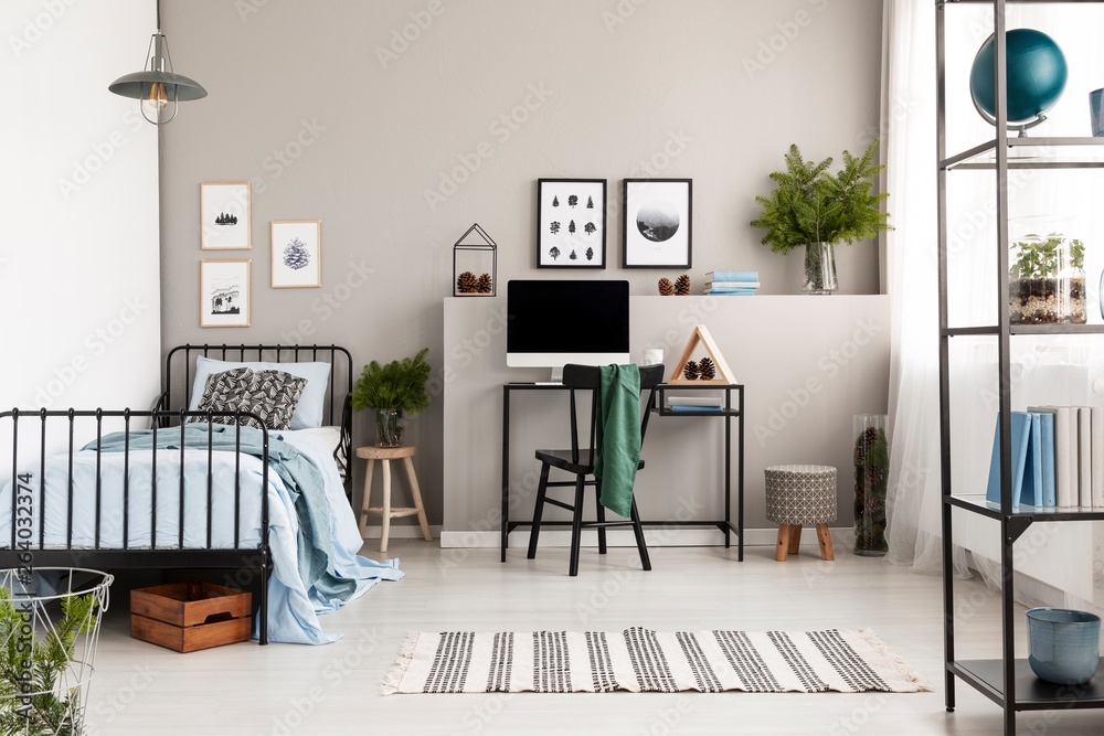 Workspace with industrial desk with computer in stylish teenager's ...