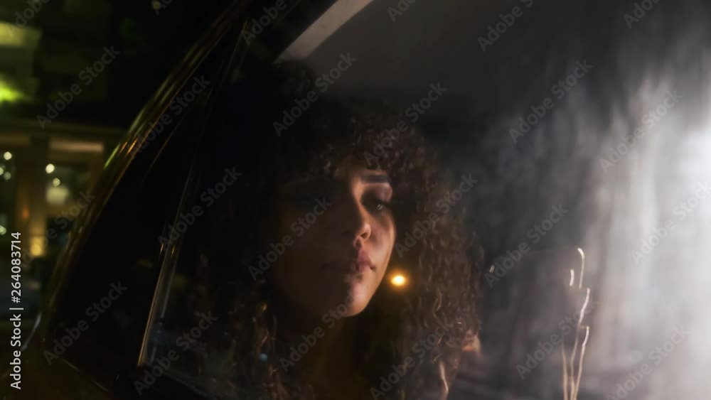 Beautiful Afro American woman tourist traveling in a taxi and rewritten ...