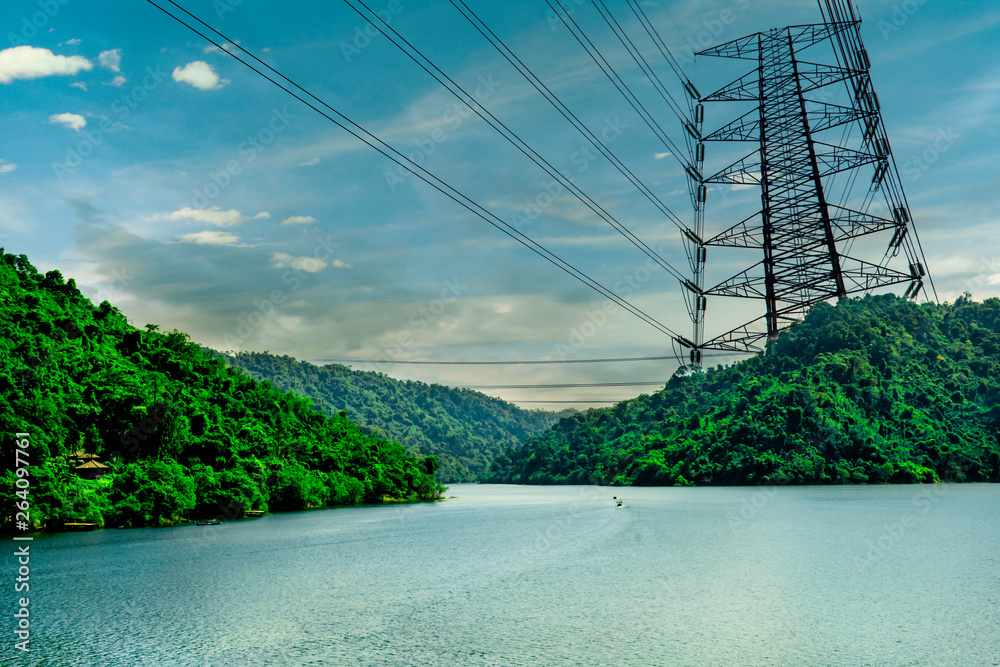 Electricity transmission line with green tree mountain, Green ...