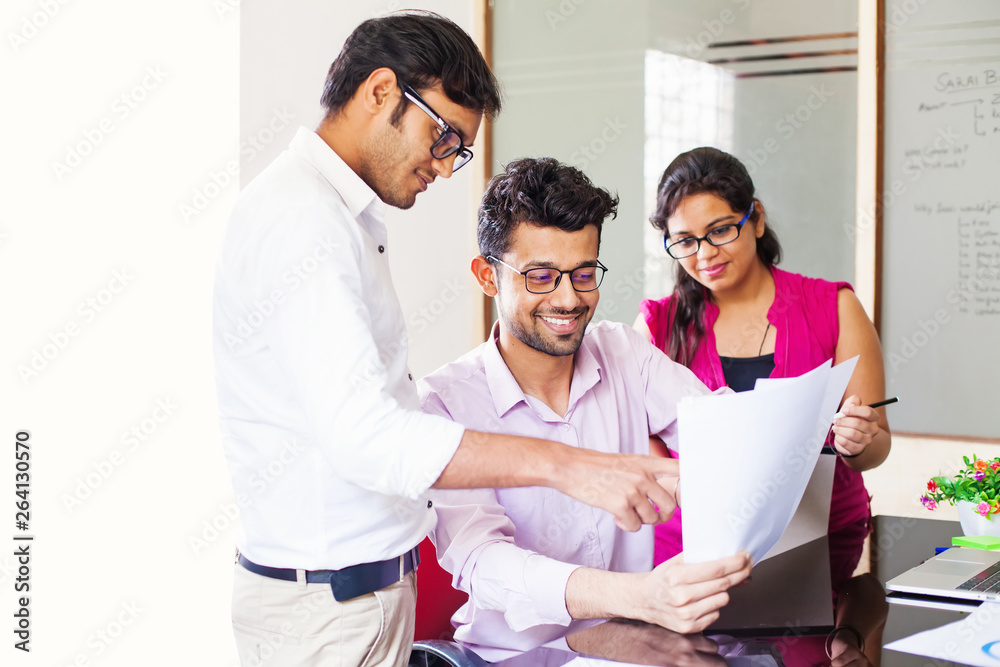 Indian team discussing the document Stock Photo | Adobe Stock