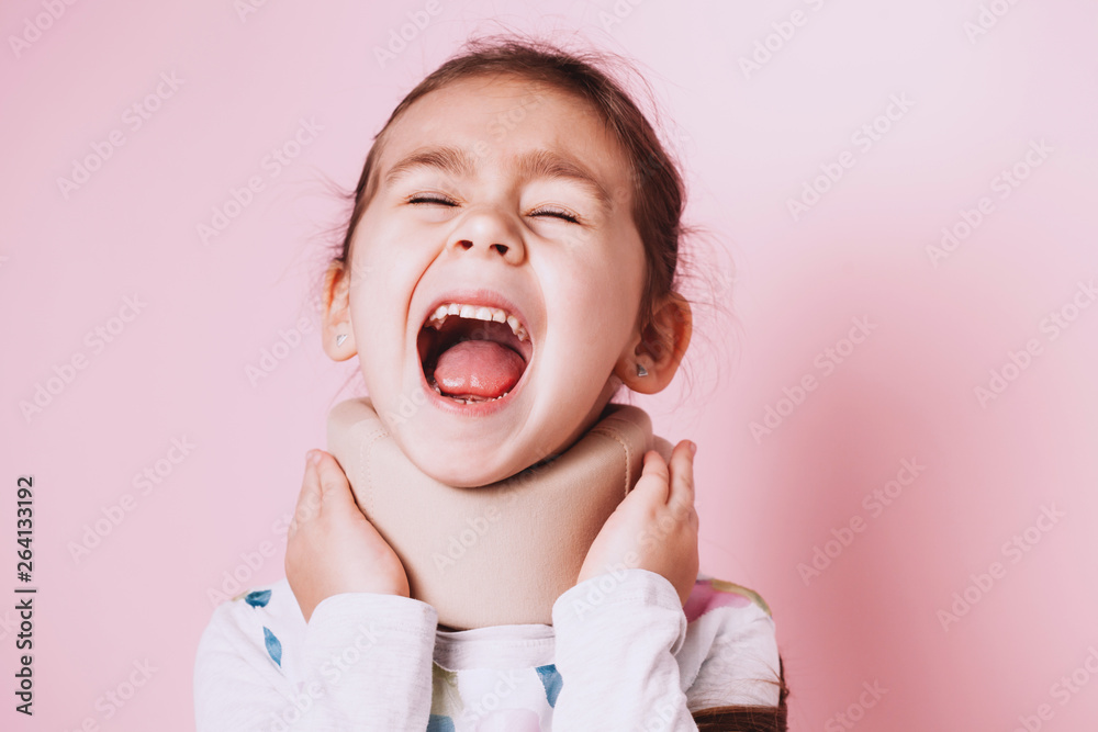 Portrait of Little girl wearing neck brace on pink background. Stock ...