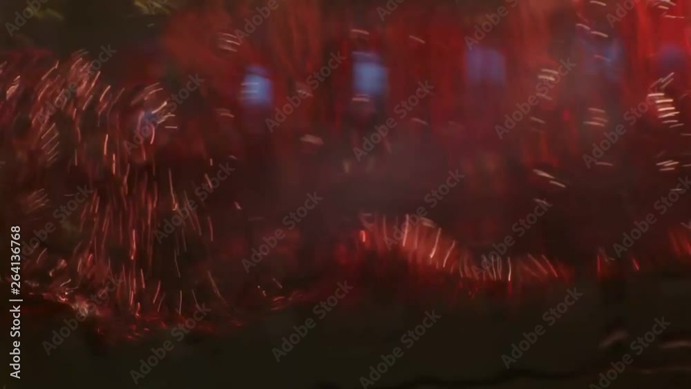 dark red liquid shaken in a transparent plastic container.close-up ...