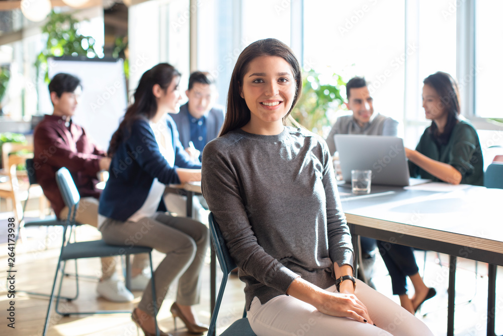 Young abroad student and her classmates in background Stock Photo ...
