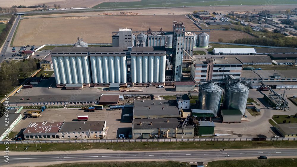 A huge oil refinery with metal structures, pipes and distillation of ...