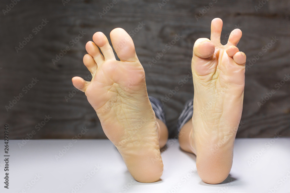 Feet care concept, female feet over wooden background Stock Photo ...