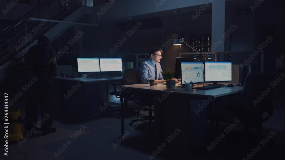 Working Late at Night in the Office: Businessman Uses Desktop Computer ...