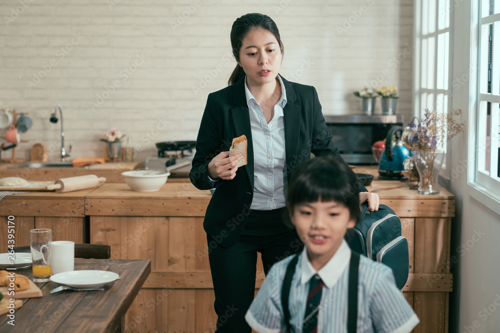 young busy asian employee mother rushing with daughter in morning going ...