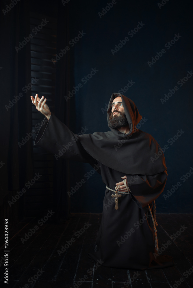 Medieval monk kneeling and praying, religion Stock Photo | Adobe Stock