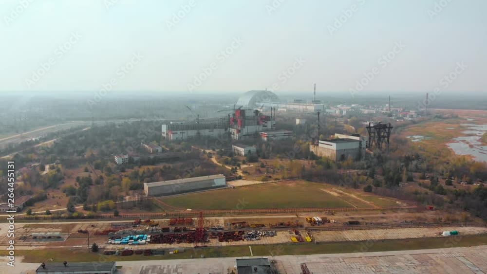 Aerial view of the Chernobyl nuclear power plant, backward movement ...