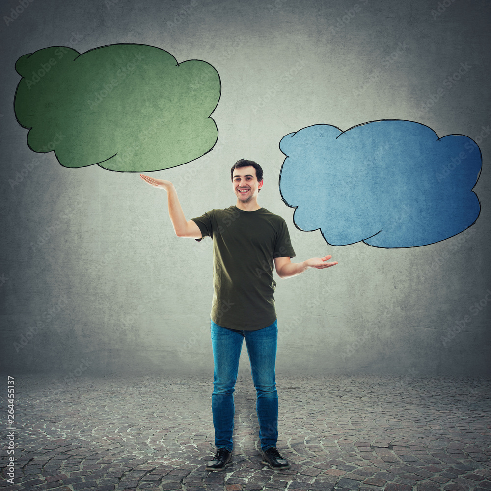 Guy comparing two things. Stock Photo | Adobe Stock