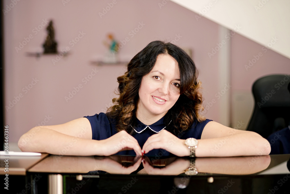 The secretary in the office behind the reception desk Stock Photo ...