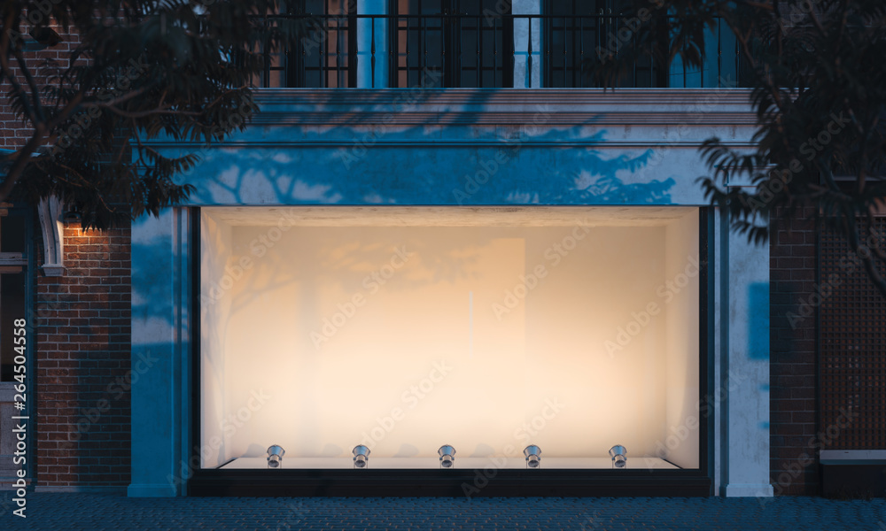 Empty illuminated storefront. night time. 3d rendering. Copy space ...