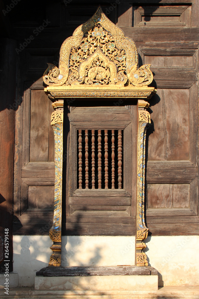 window of a pavilion in a buddhist temple (wat phan tao) in chiang mai ...