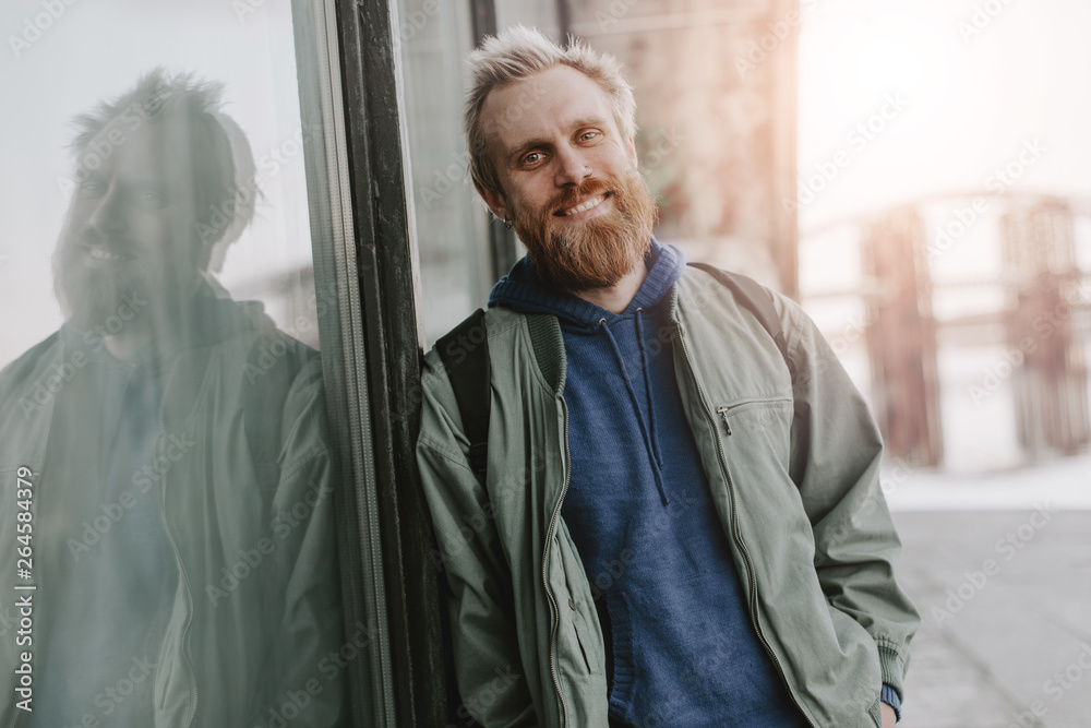 Alone male person on steet. Nice positive young man posing on camera ...