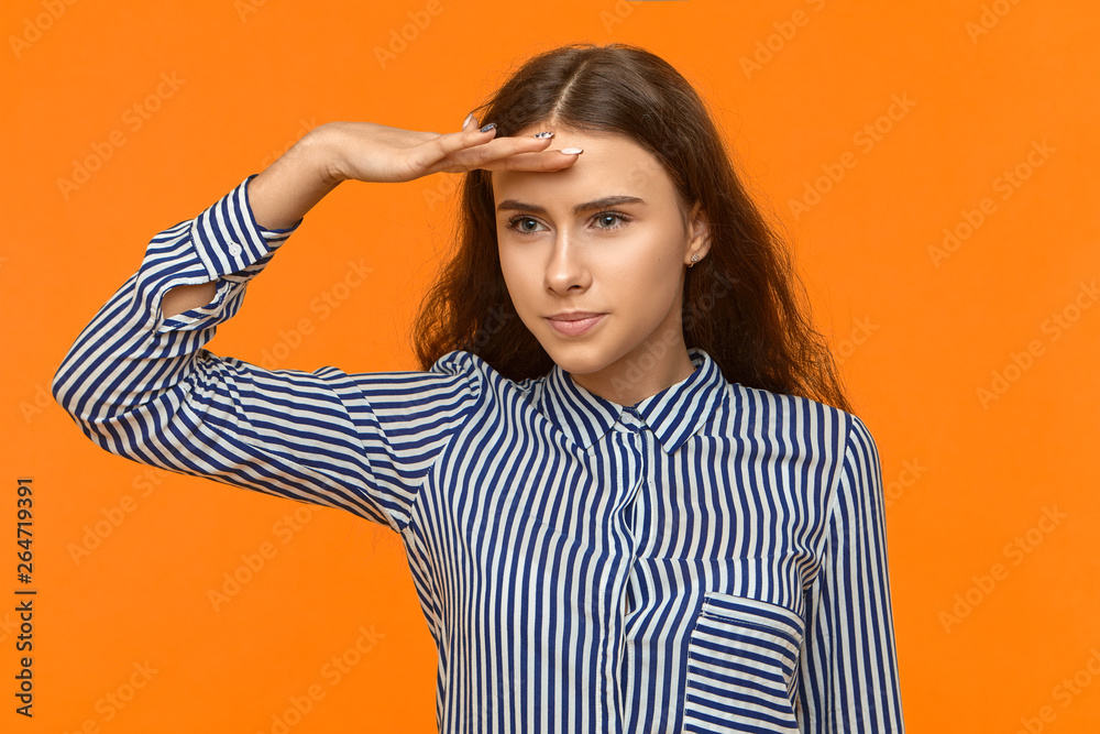 Beautiful charming young woman with excited smile posing at blank ...