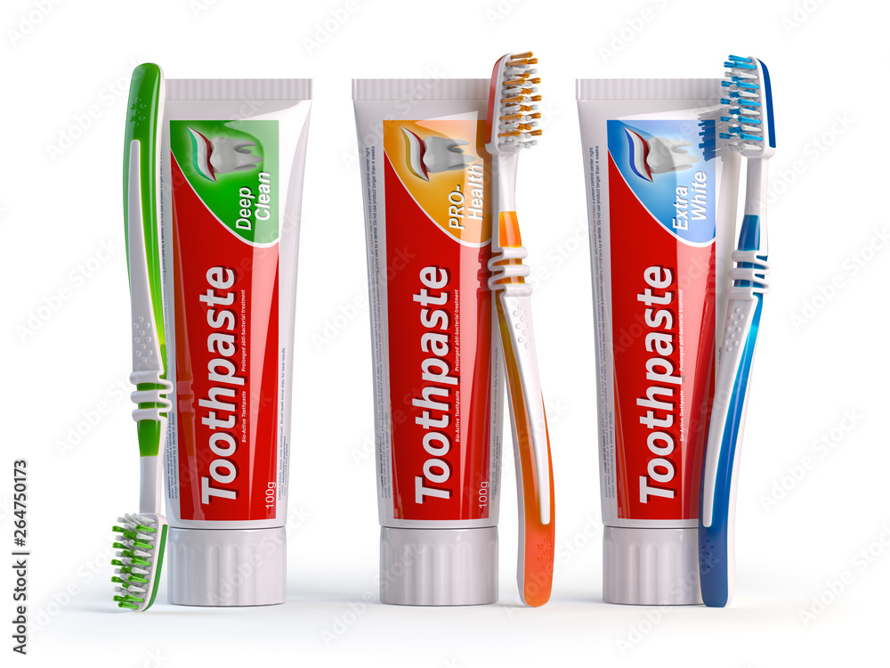 Toothpaste of different types and toothbrushes of different colors ...