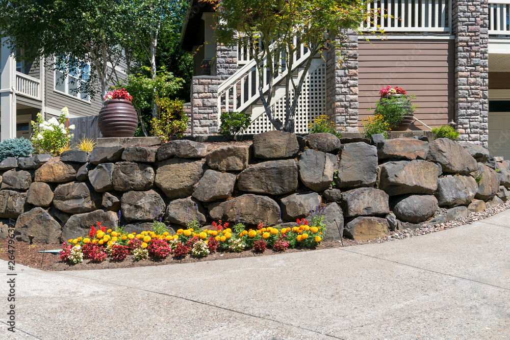 House Front Yard Landscaping with Rock Retaining Wall Stock Photo ...