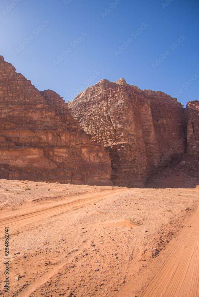 A beautiful day in the Jordanian desert of Wadi Rum. wide dessert with ...