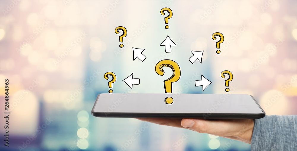 Big and small question marks with arrows with man holding a tablet ...