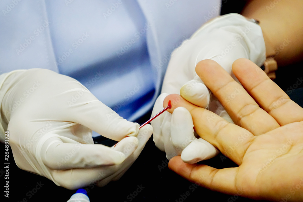 Closeup hands of nurse wear a rubber white medical gloves using ...