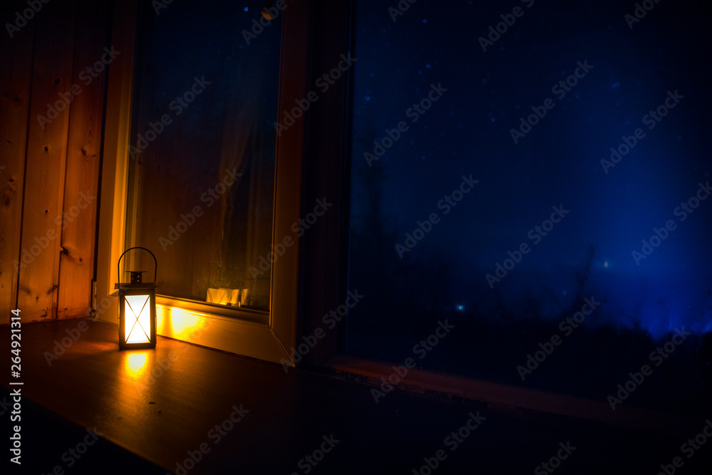 Night scene of stars seen through the window from dark room. Night sky ...