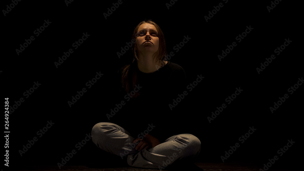 Depressed woman praying for end of suffering, victim of domestic ...