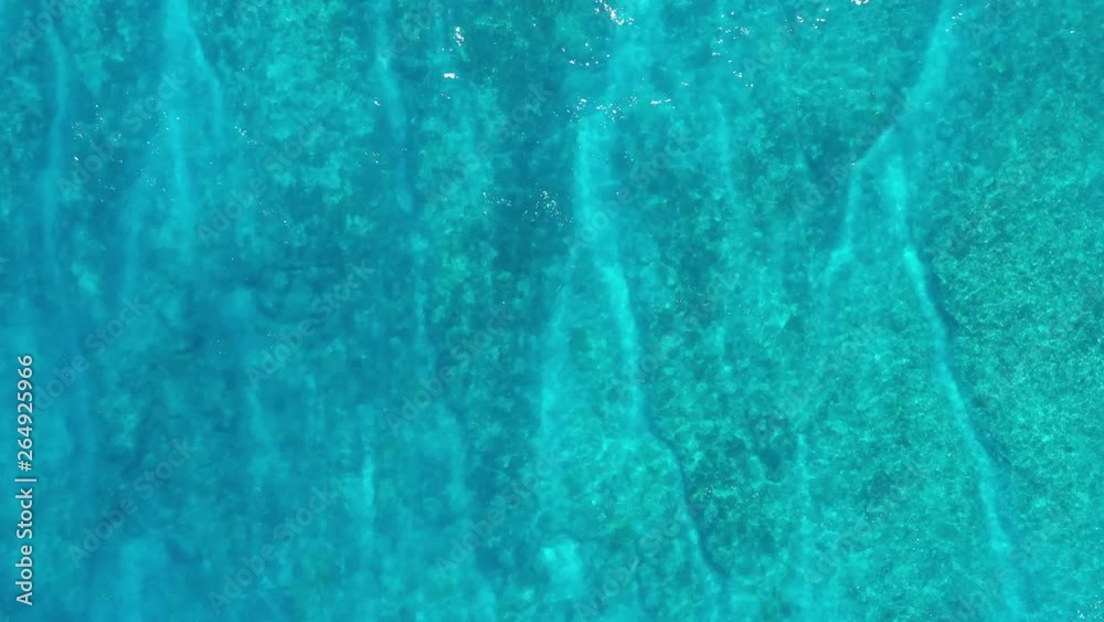 Waves and azure water as a background. View from high rock at the ocean ...